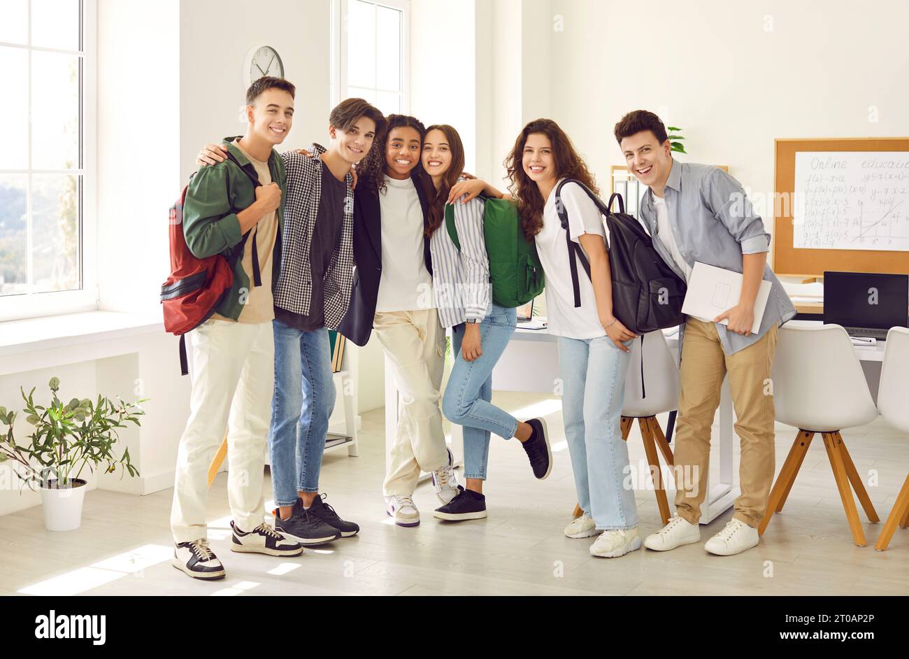 Group of a happy school or college students standing together in ...