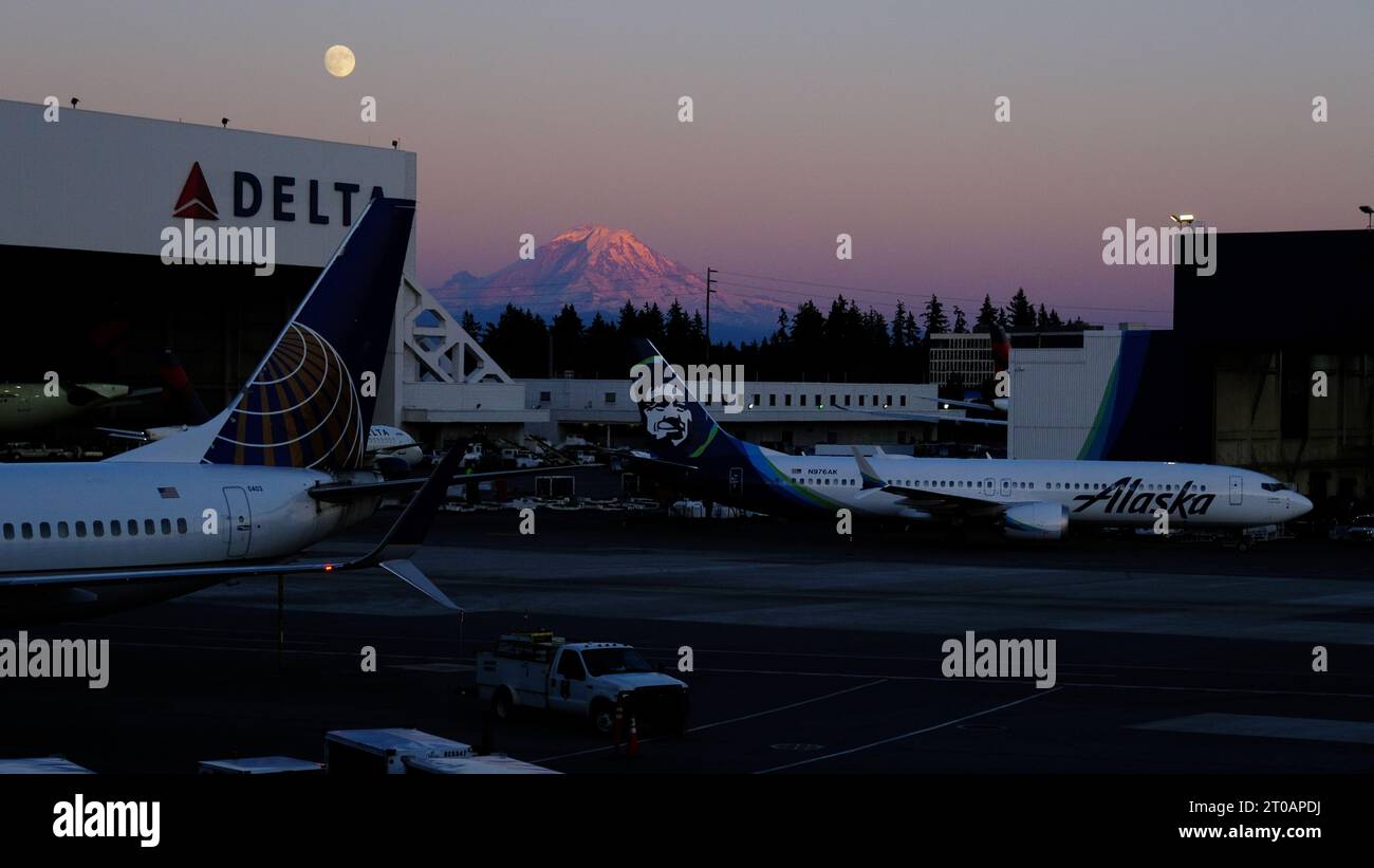 Full moon rising over SeaTac Airport south of Seattle with Mt. Rainier ...