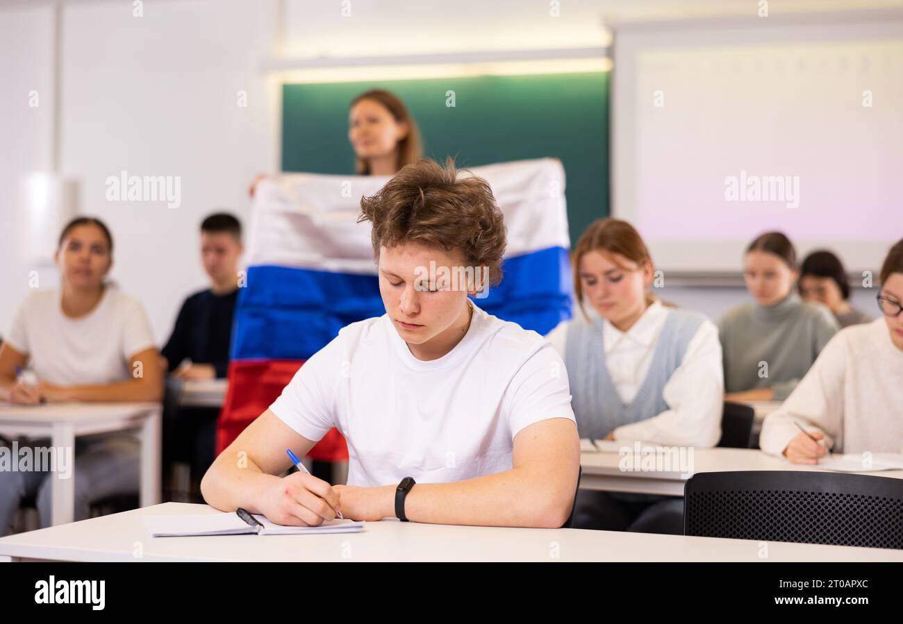 Female teacher tells her classmates about the country of Russian ...