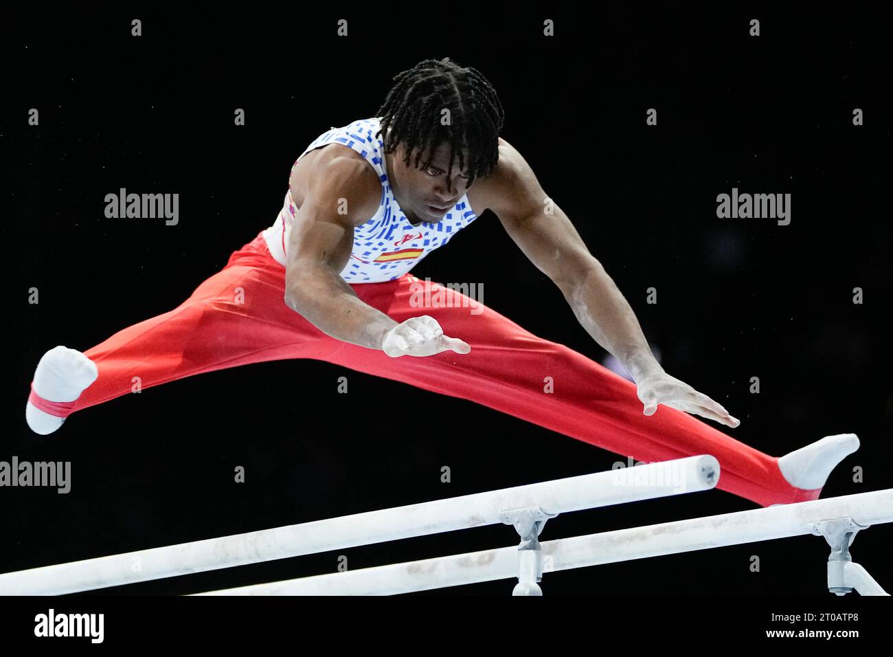 Spain's Thierno Diallo competes on the parallel bars during the men's ...
