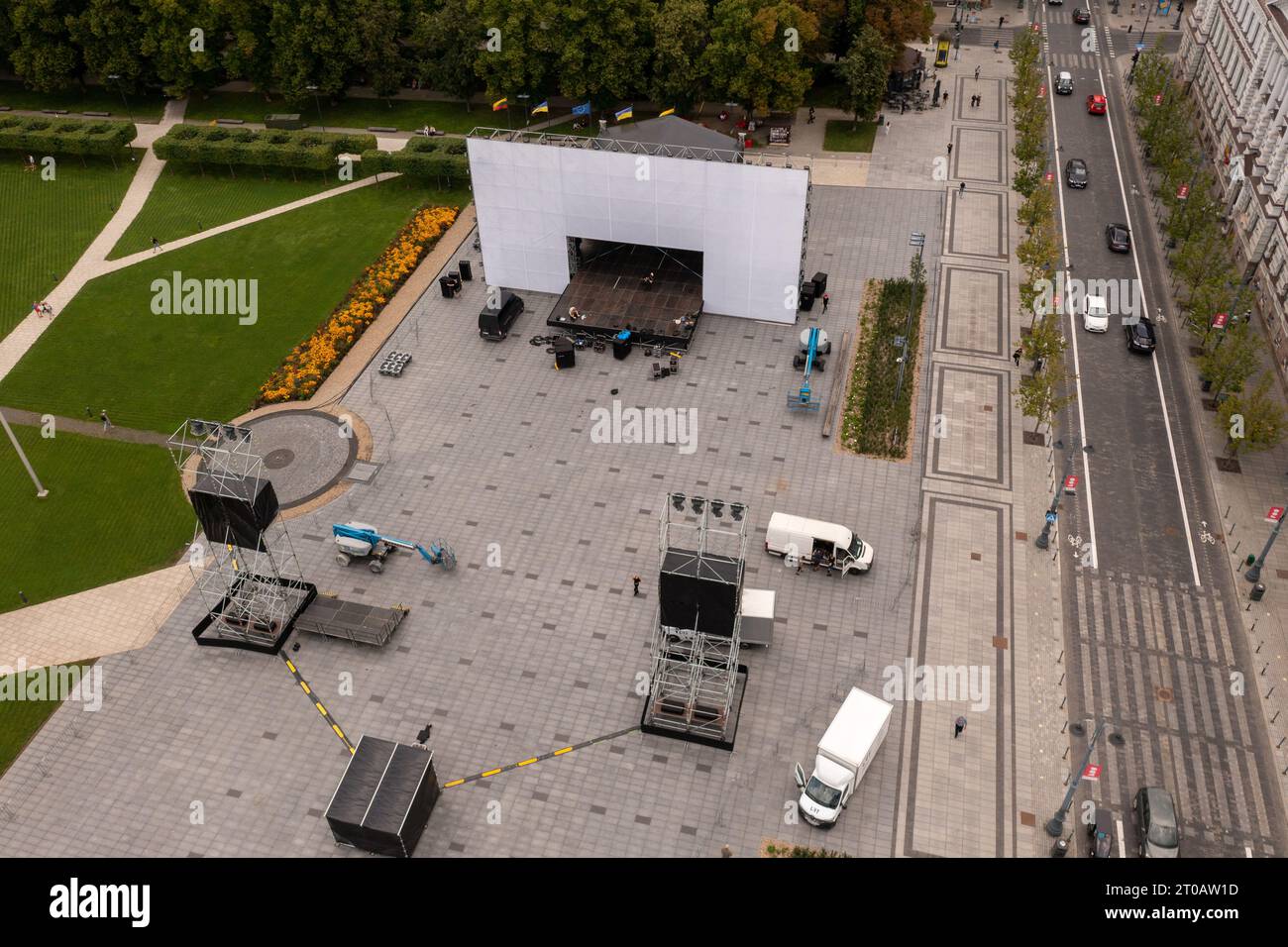 Drone photography of musical stage being set up in a city square during ...