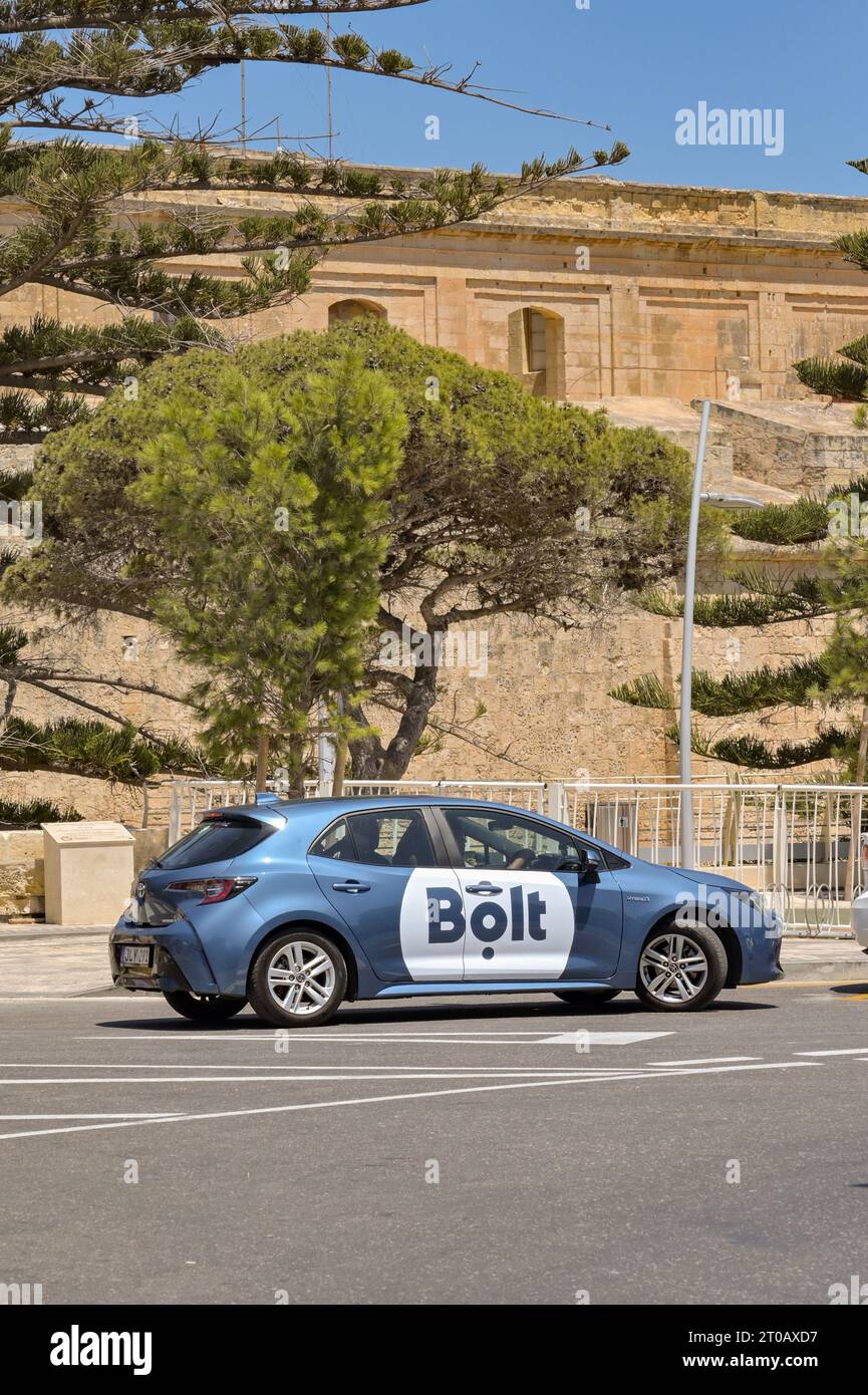 Mdina, Malta - 4 August 2023: Bolt taxi about to leave the old city of ...
