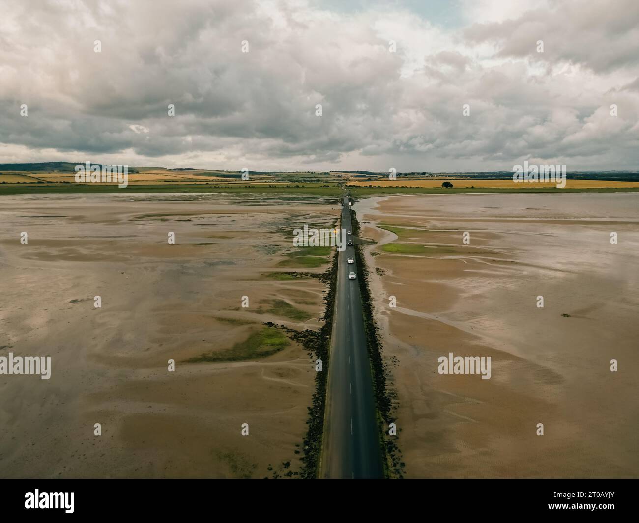 The causeway to Holy Island photographed with a spectacular Sunrise ...