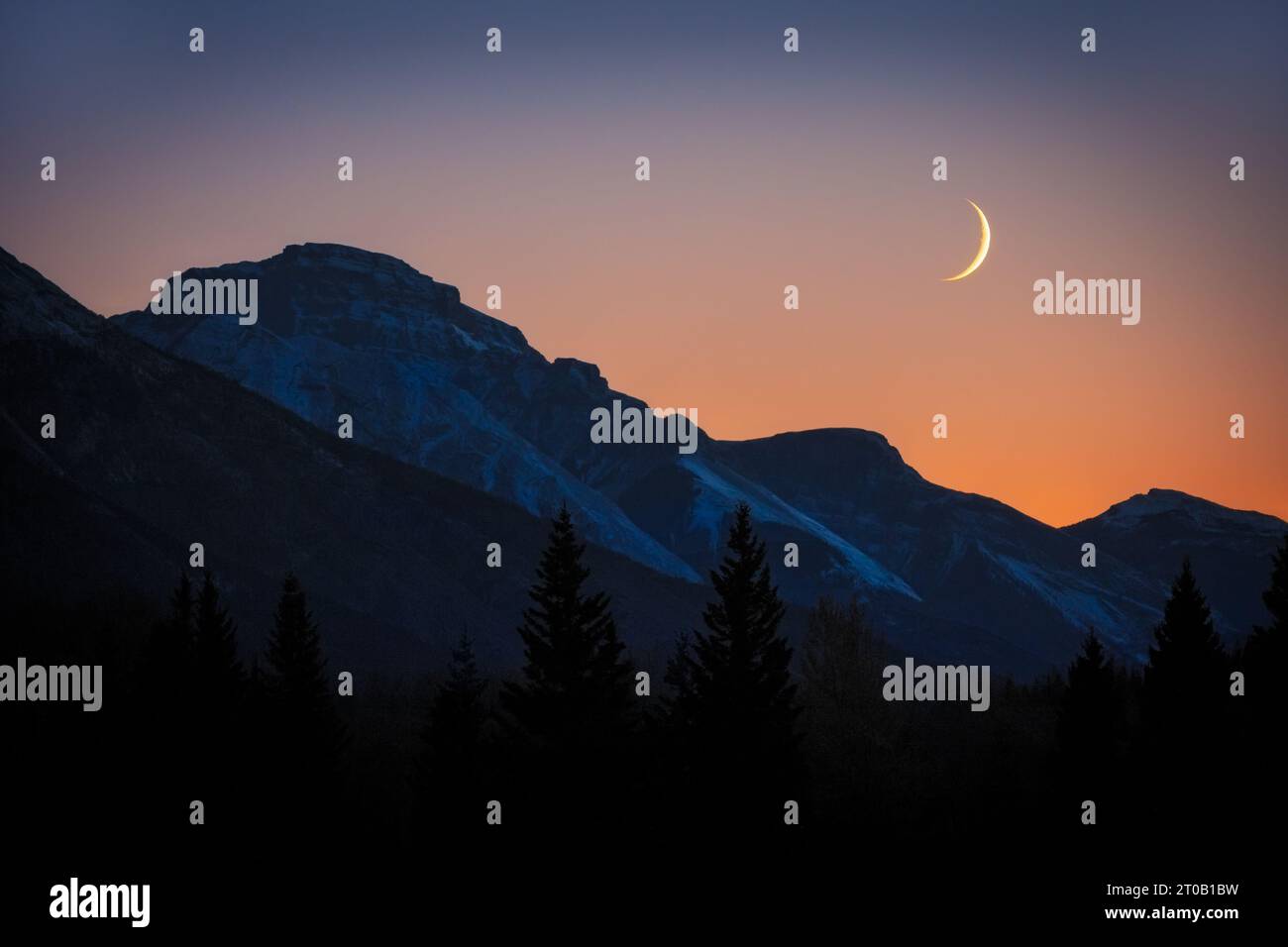 Evening moon in Banff, Banff National Park, Alberta, Canada Stock Photo ...