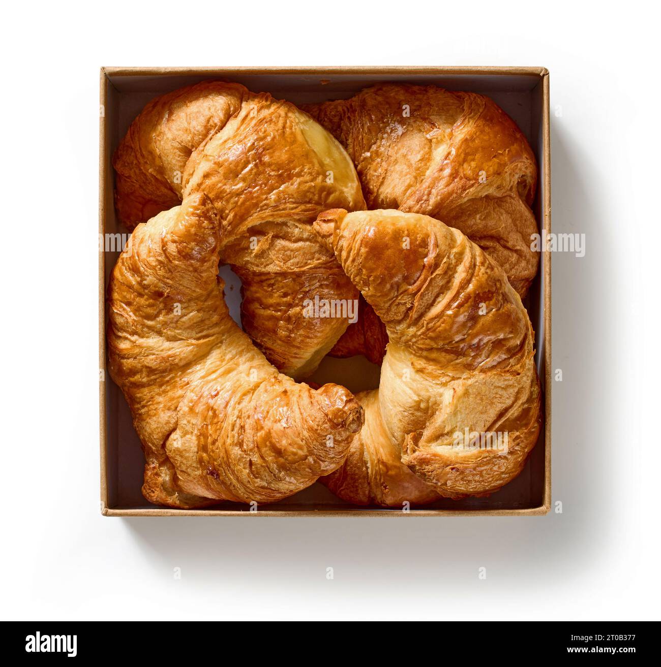 box of freshly baked croissants isolated on white background, top view ...