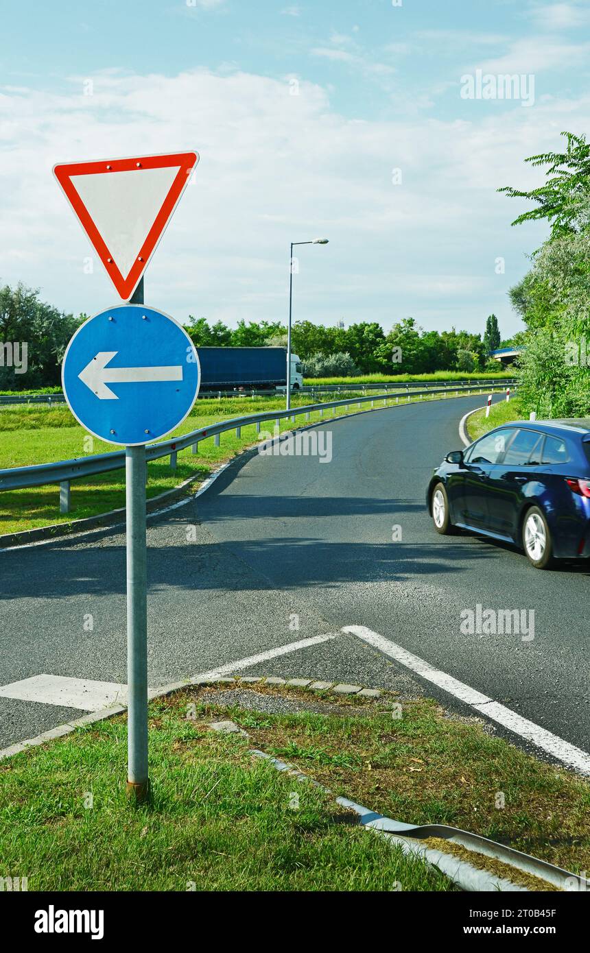 Road signs at the exit from the parking lot to the freeway in Hungary ...