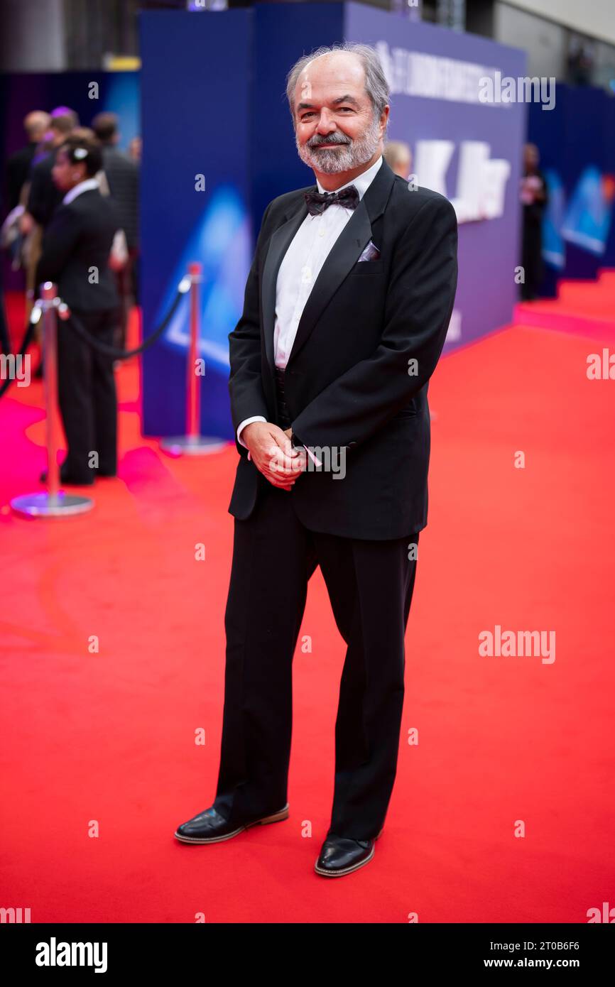 Peter Mavromates poses for photographers upon arrival for the premiere ...