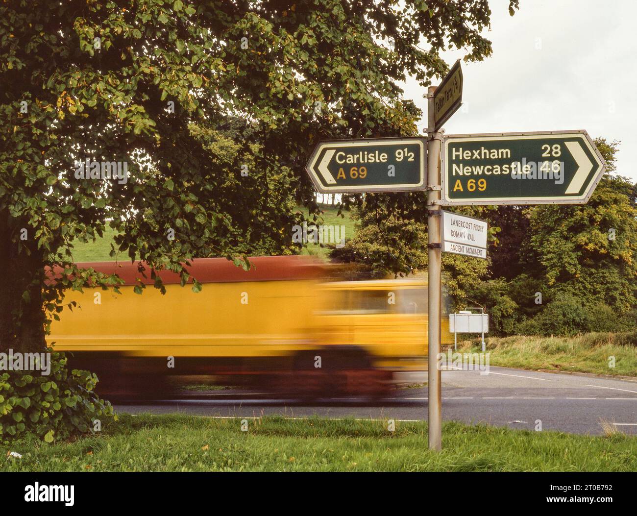Traffic passing a road sign Stock Photo - Alamy