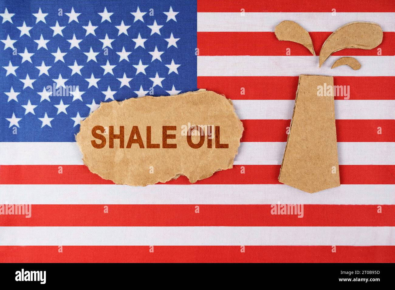 On the US flag there is an oil rig cut out of cardboard and a sign with ...