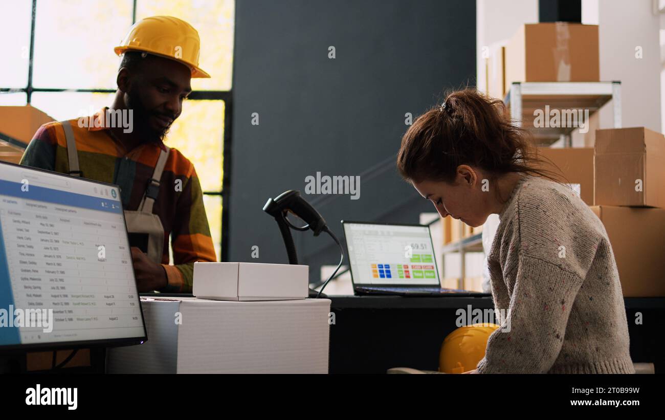 Supervisor inspecting cargo logistics in storage room, working on ...