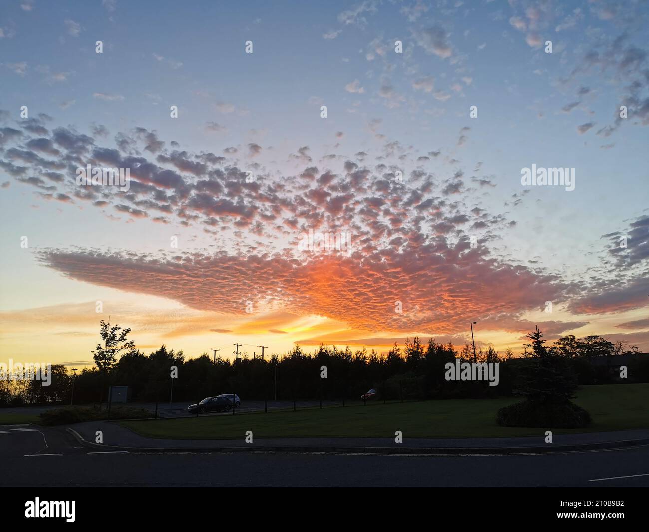 Sunset Through the Clouds Stock Photo - Alamy