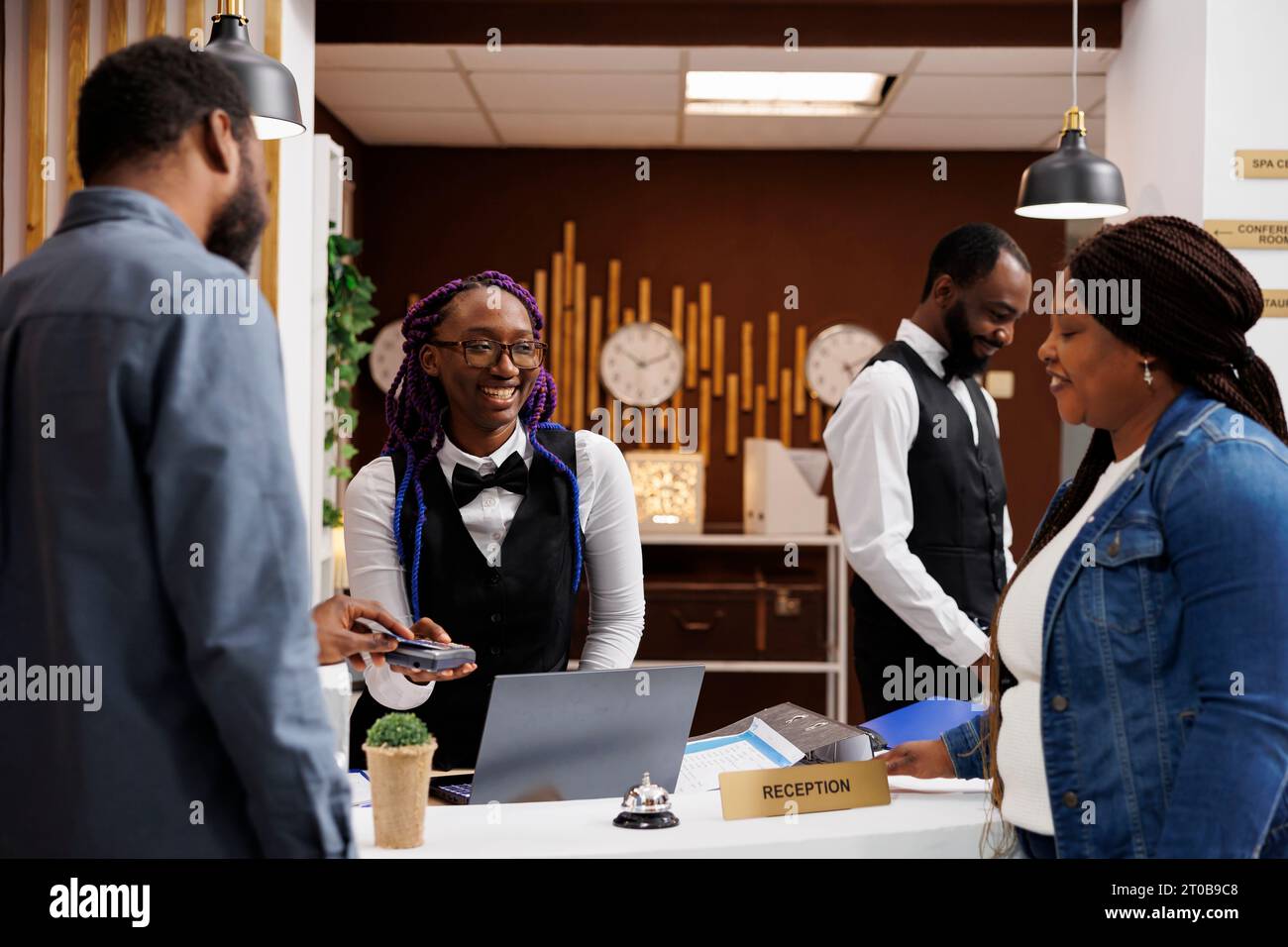 Hotel lobby black woman female employee front desk hi-res stock ...