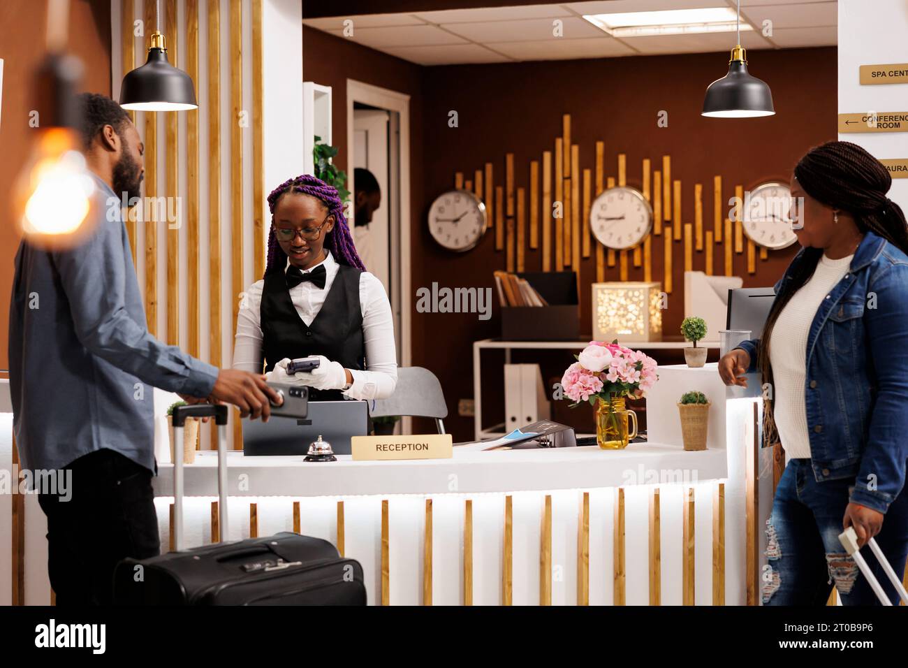 Tourists using nfc payment reception hi-res stock photography and ...