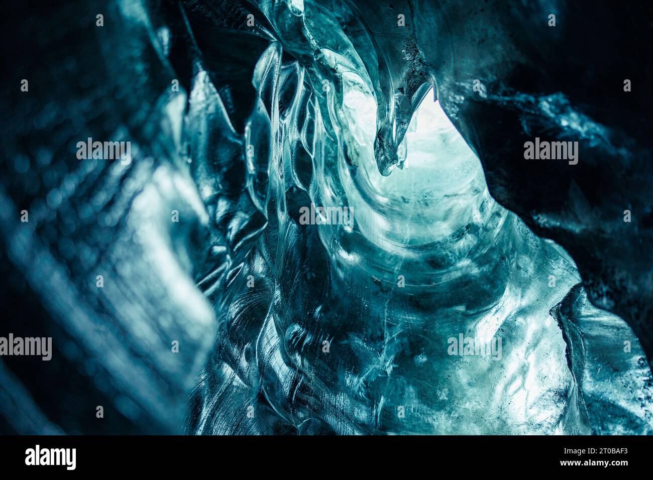 Winter region with frozen shattered rocks and Vatnajokull blue icy ...