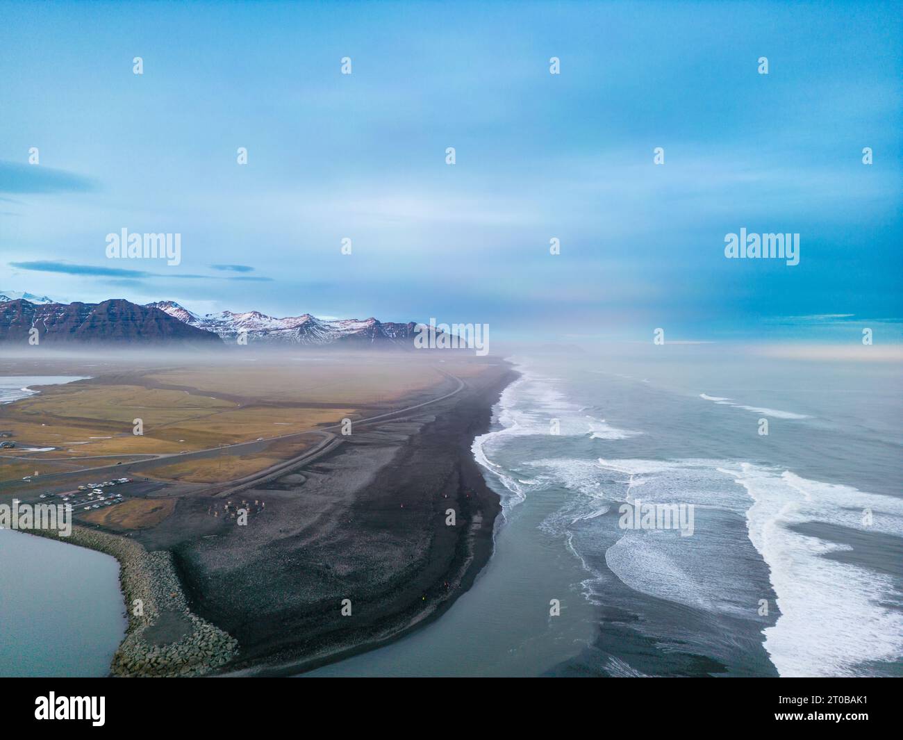 Atlanic shore black sand beach with massive waves crashing on icelandic ...