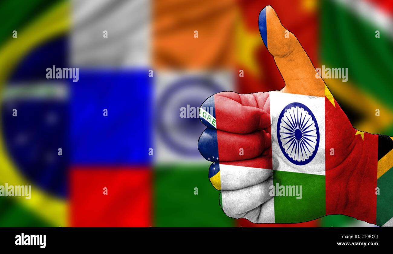thumbs up in approval with the BRICS flag painted Stock Photo - Alamy