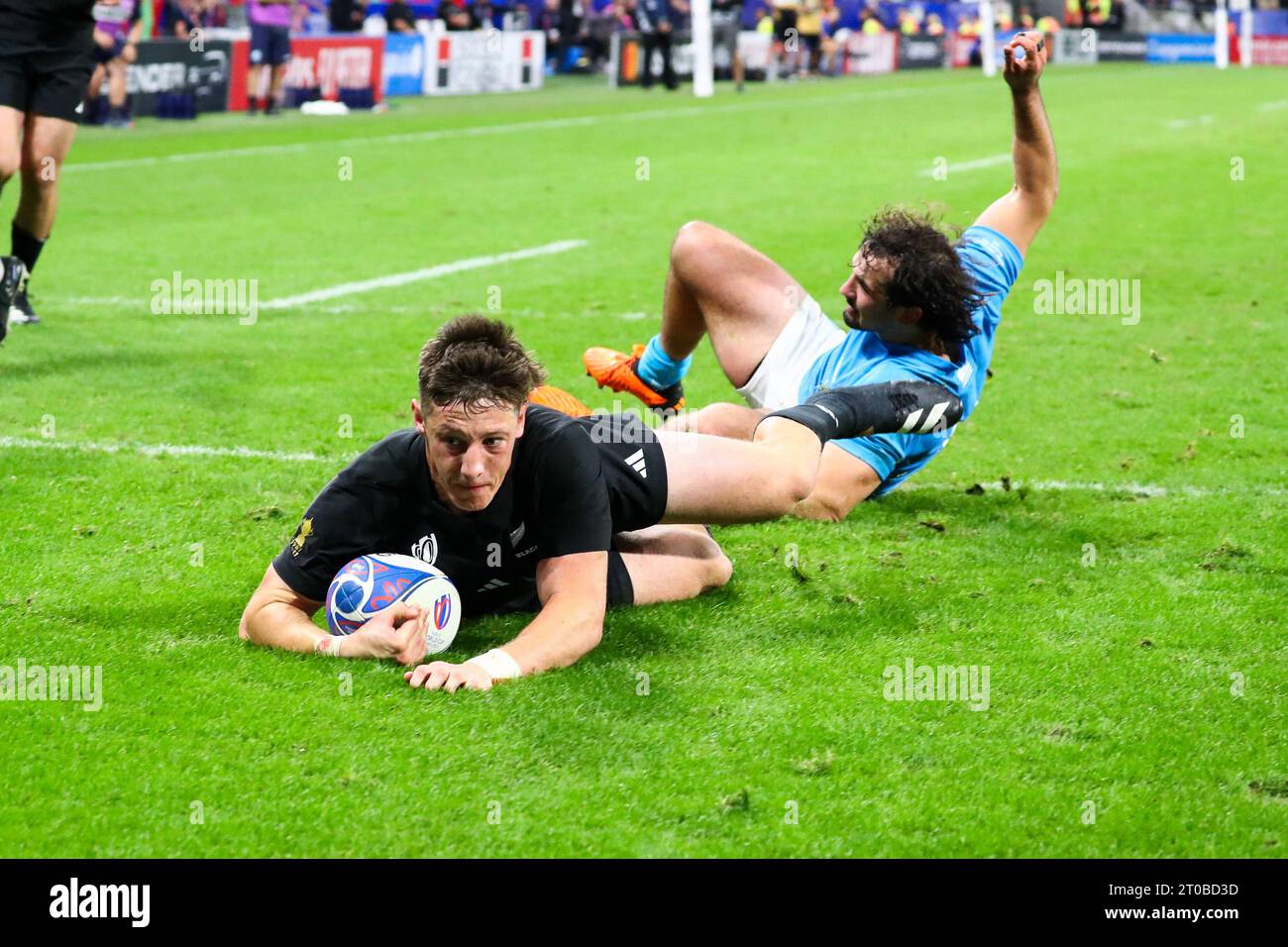 Cam Roigard #9 of New Zealand scores during the Rugby World Cup Pool A ...