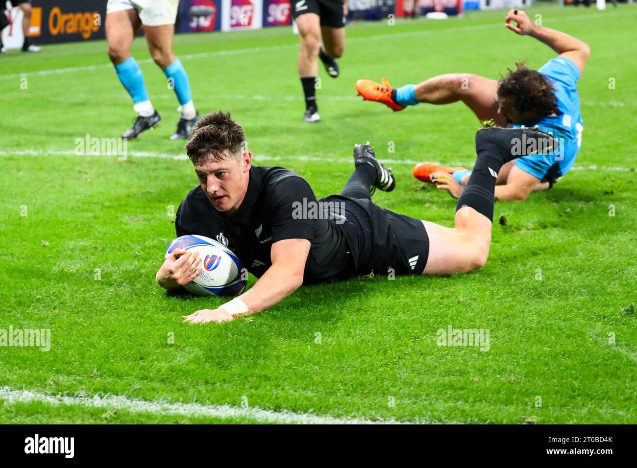 Cam Roigard #9 of New Zealand scores during the Rugby World Cup Pool A ...