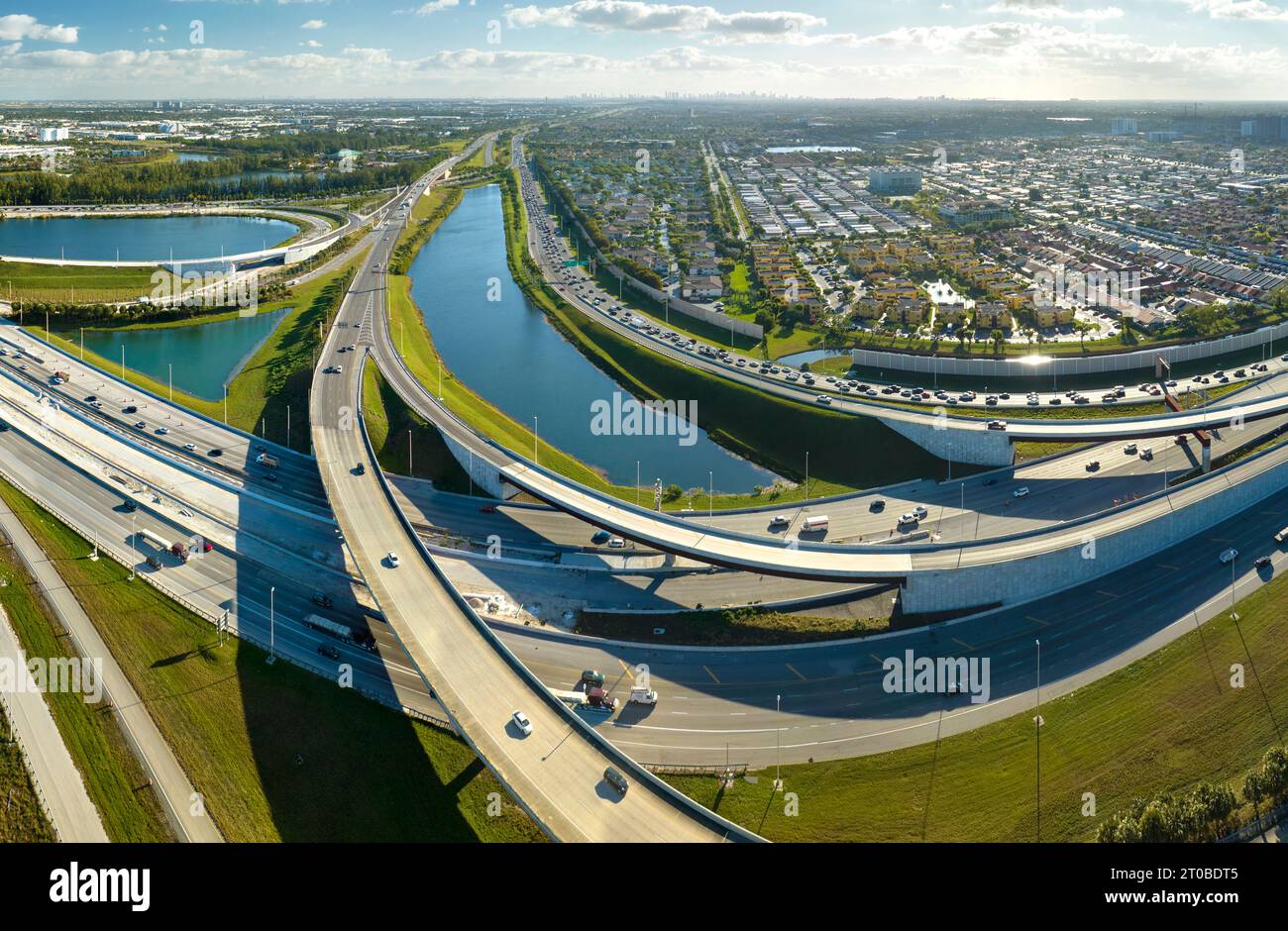 Aerial view of american freeway intersection with fast driving cars and ...