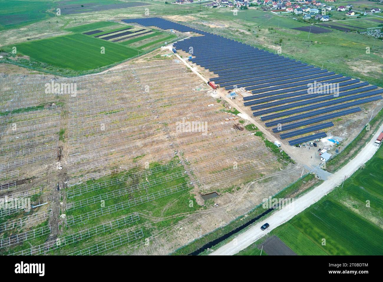 Aerial view of big electric power plant under construction with many ...