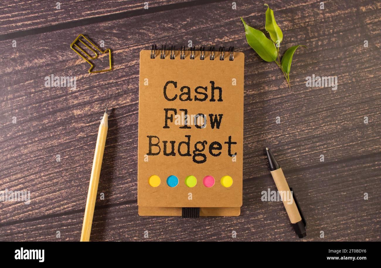 Cash flow text concept on notebook with office tools and paper ...