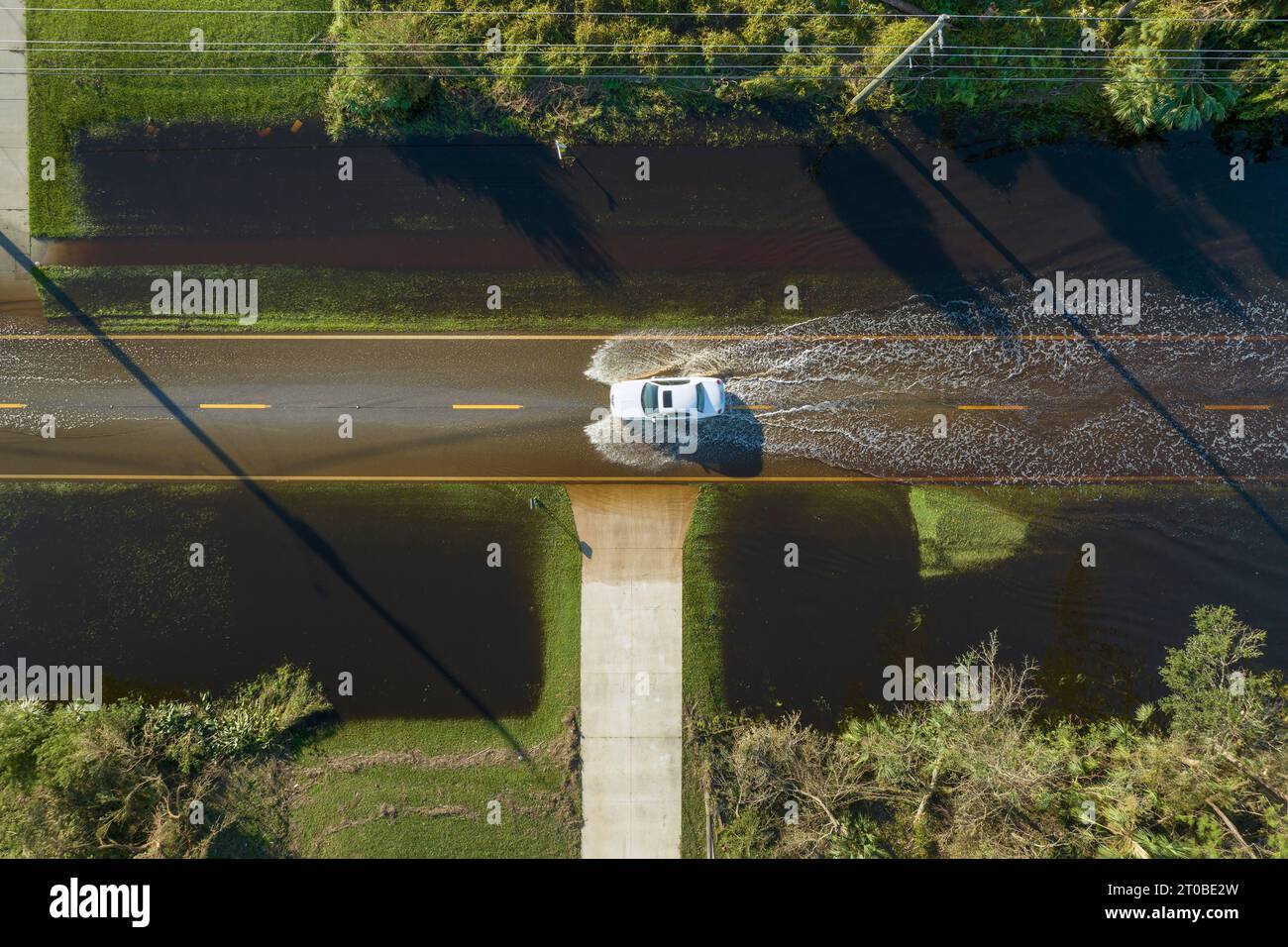 Aerial view of flooded street after hurricane rainfall with driving ...