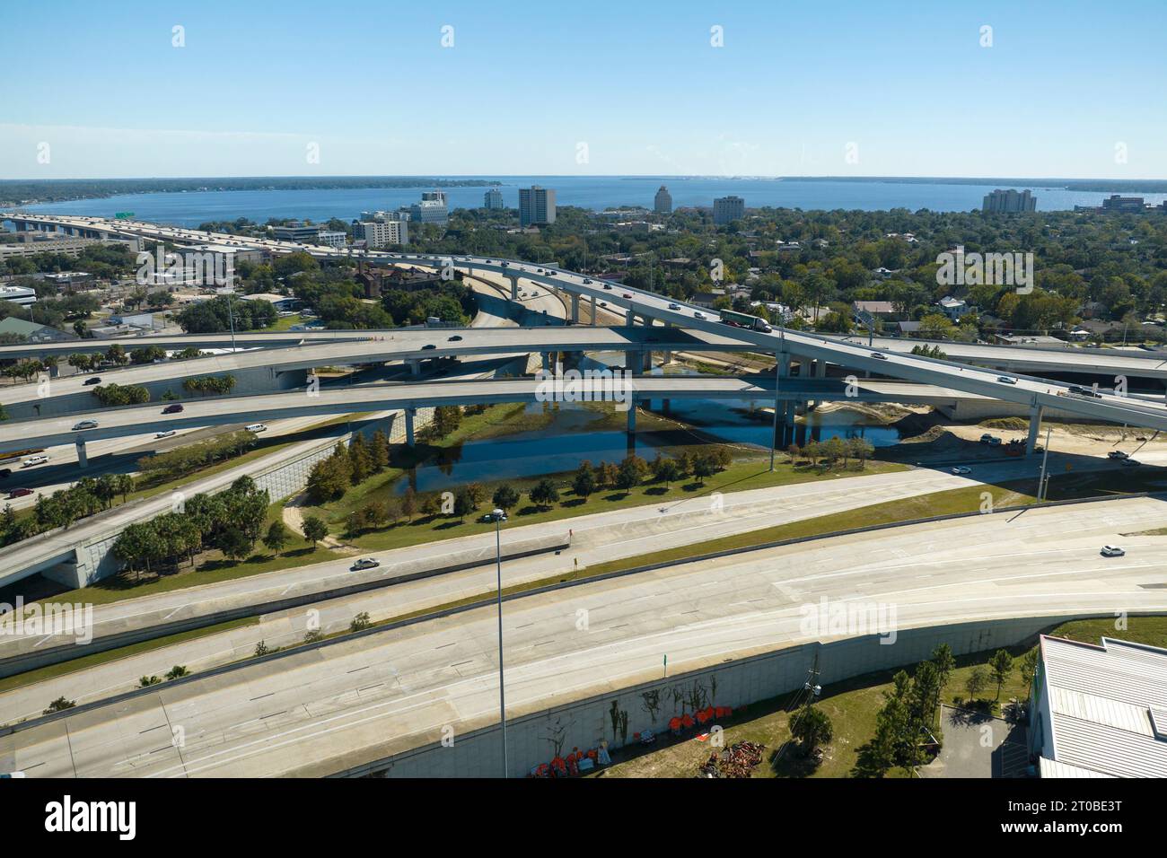 Aerial view of highway overpass with moving traffic cars and trucks ...