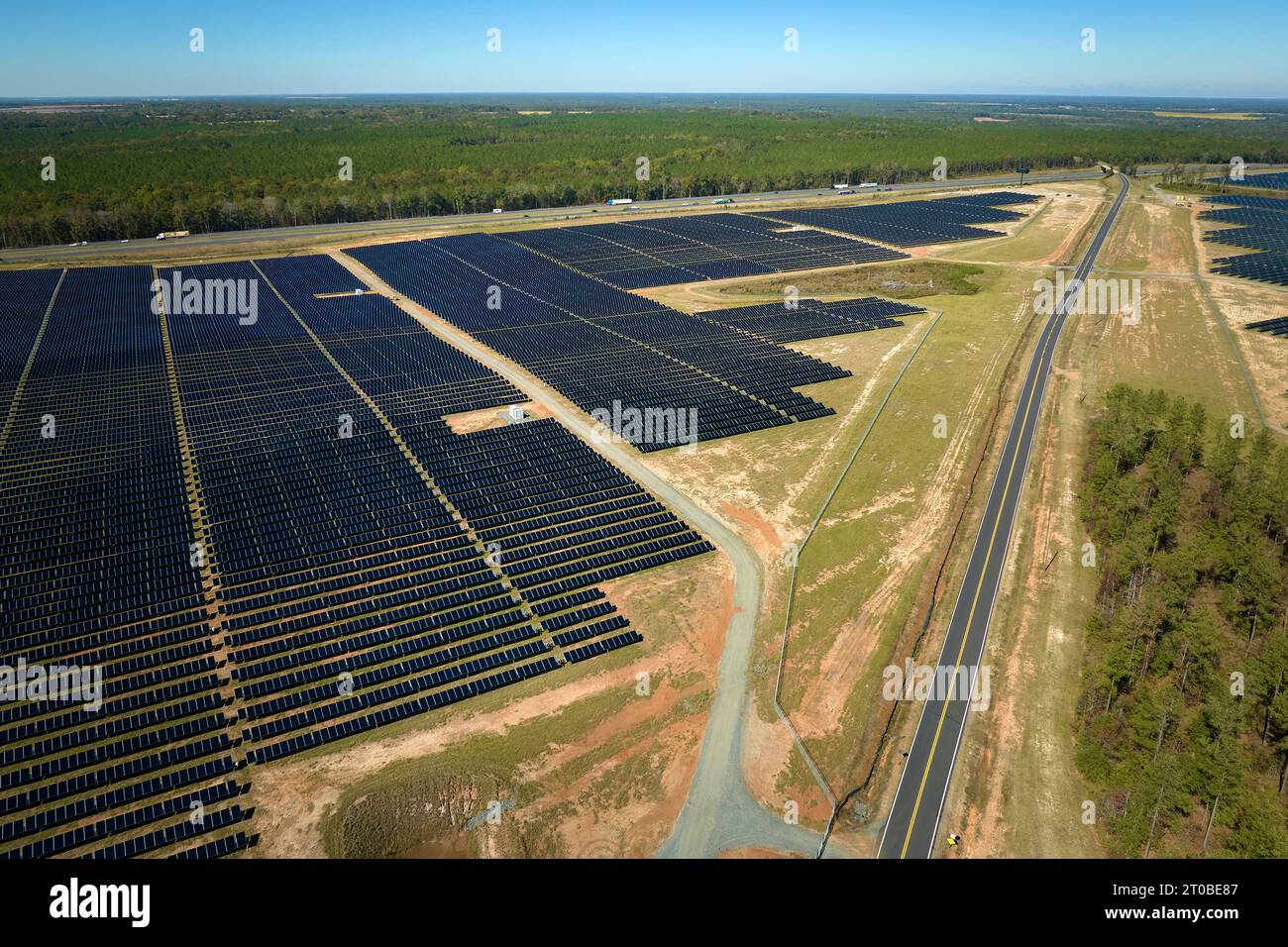 Aerial view of large sustainable electrical power plant with rows of ...