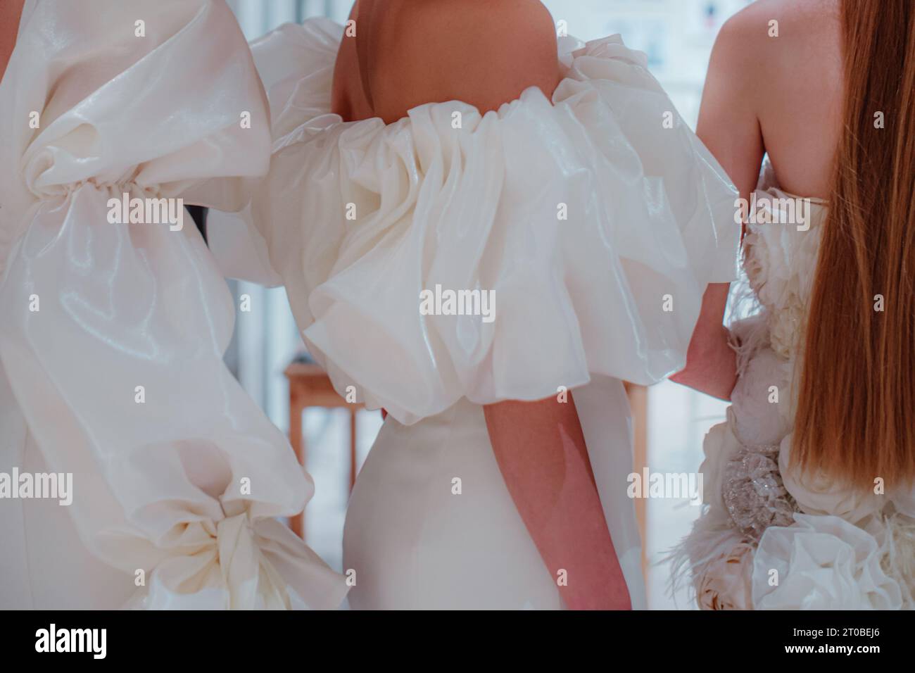 Elegant fashion details of white satin bridal dresses with puffy ...