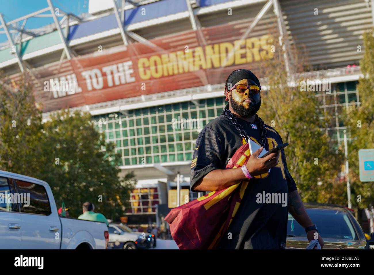 A fan is seen arriving to FedEx Field before the start of an NFL ...