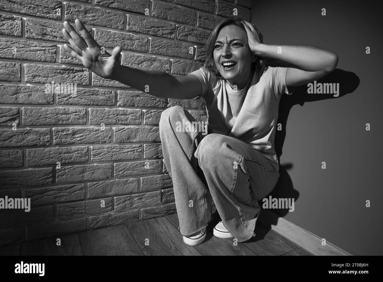 Female in corner Black and White Stock Photos & Images - Alamy