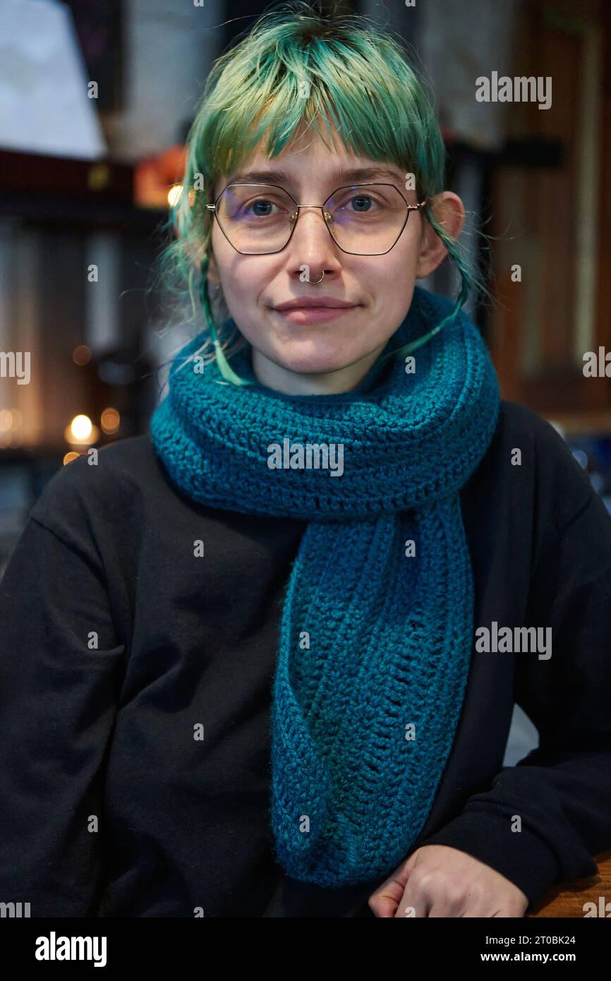 A Modern And Intriguing Girl With Striking Blue Hair Enjoys A Night Out