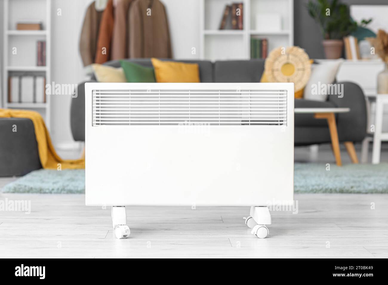 Modern radiator on floor in living room Stock Photo - Alamy