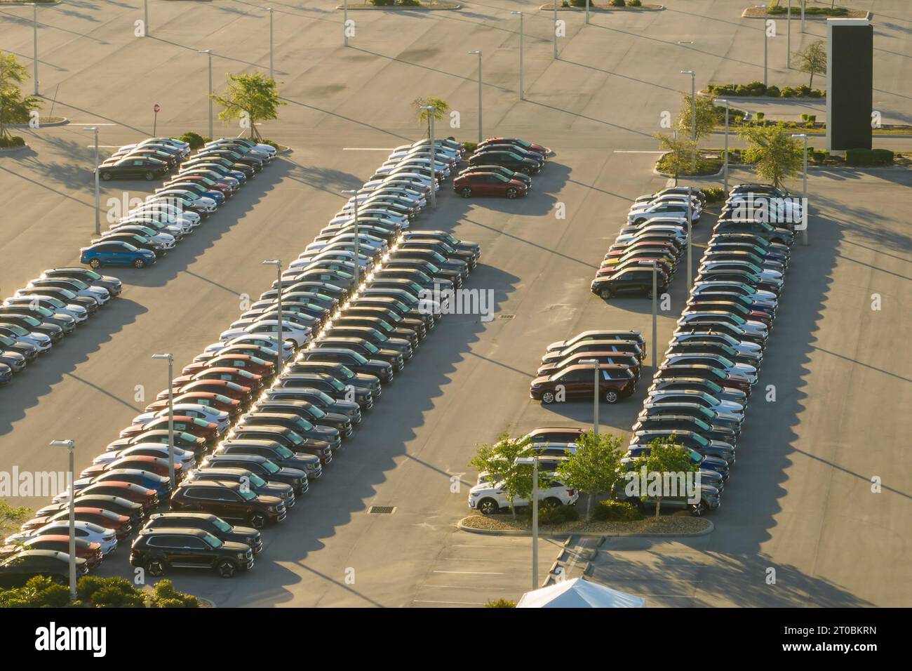 Large parking lot of local dealer with many brand new cars parked for ...