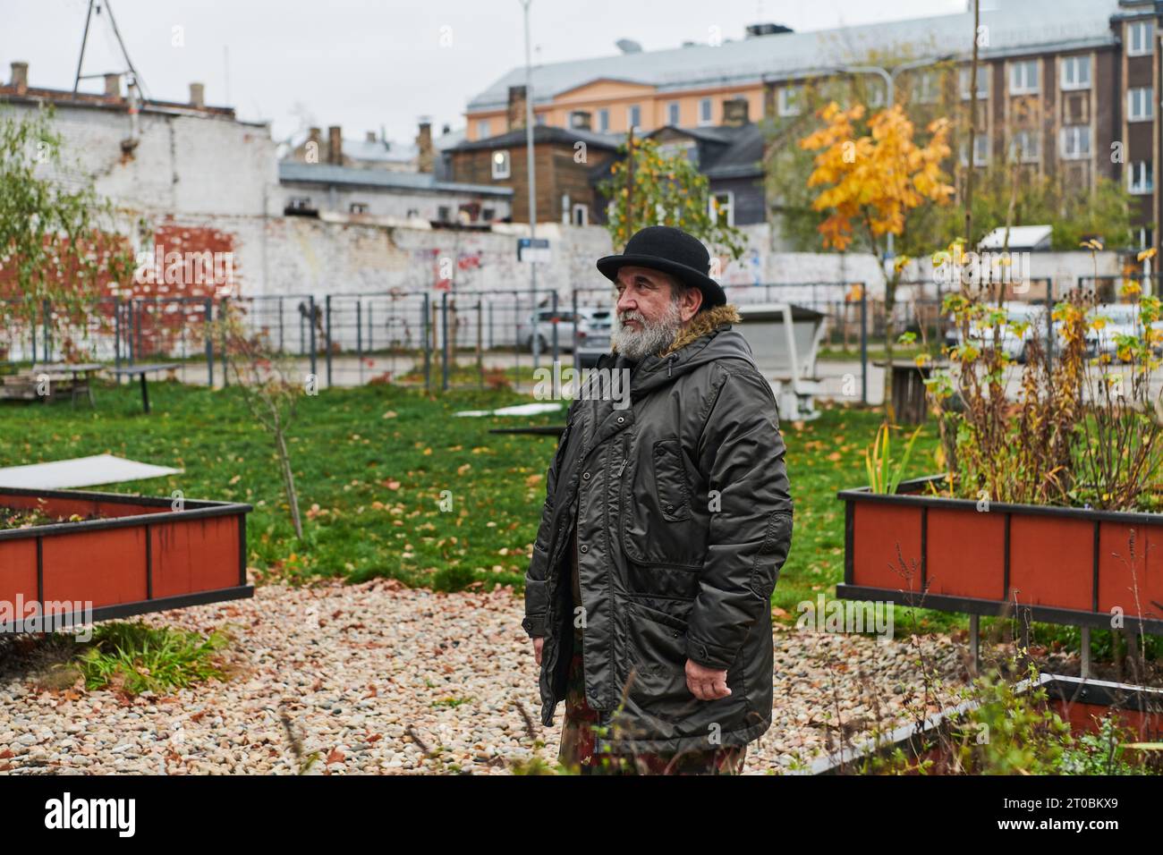 In the historic city of Riga, a bearded elderly man passionately ...