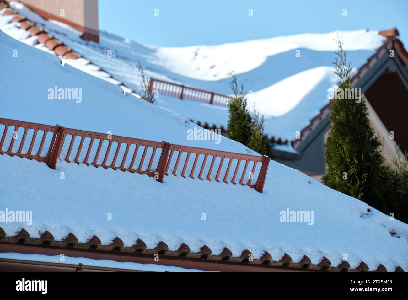 Snow guard for safety in winter on house roof top covered with ceramic ...