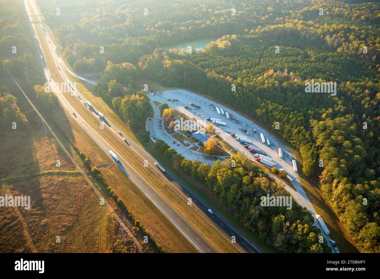 Top view of large rest area near busy multilane american freeway with ...
