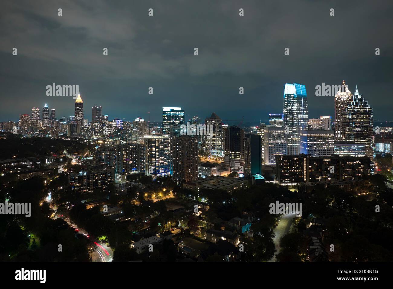 View from above of brightly illuminated high skyscraper buildings in ...