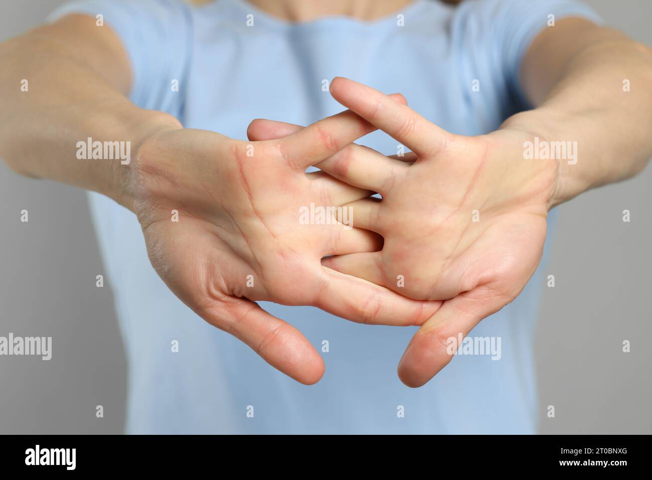 Female cracking knuckles hi-res stock photography and images - Alamy