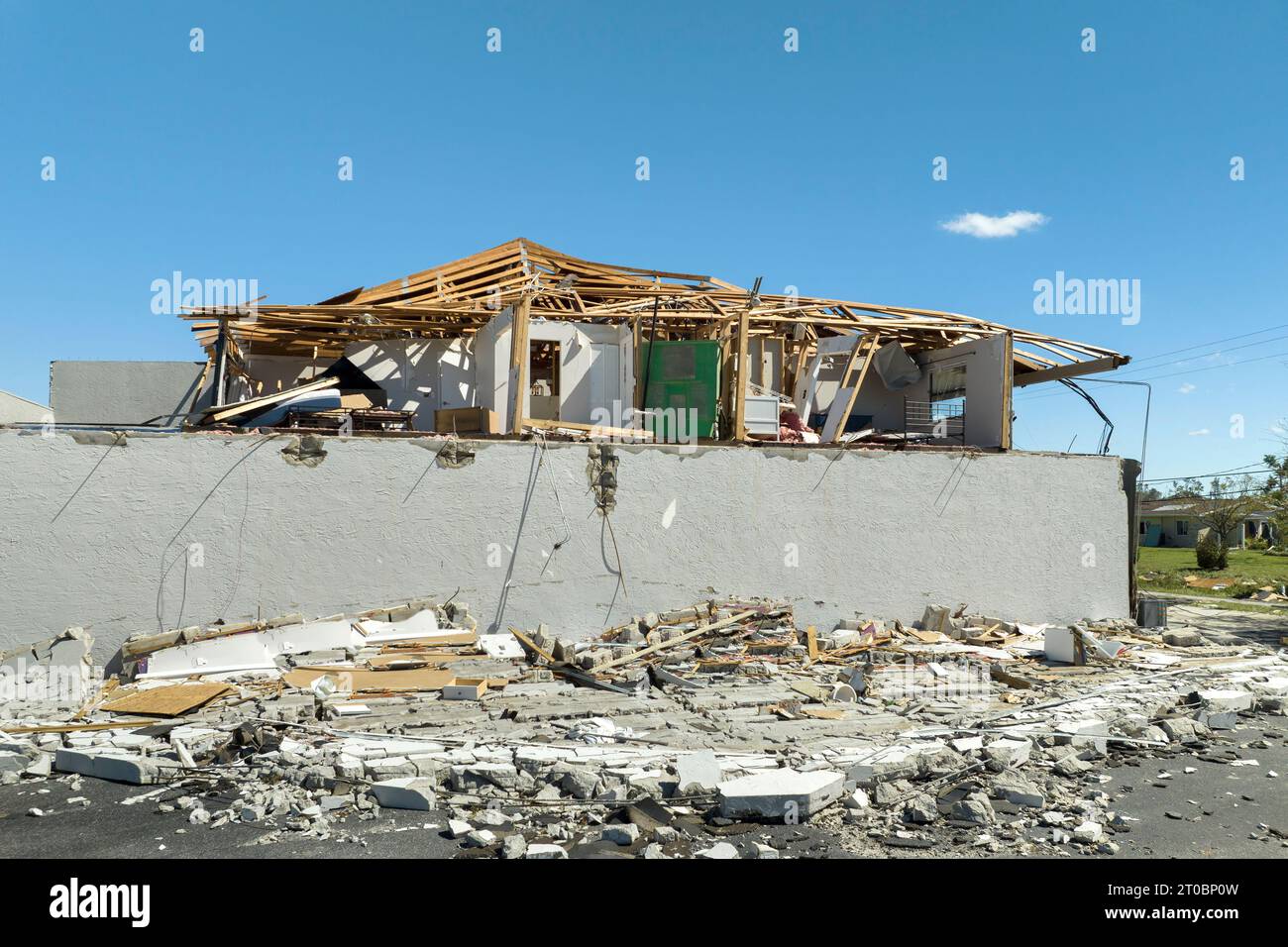 Wind destroyed house roof and walls with missing asphalt shingles after ...