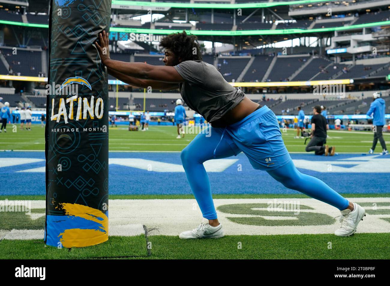 Los Angeles Chargers linebacker Chris Rumph II (94) warms up near a ...