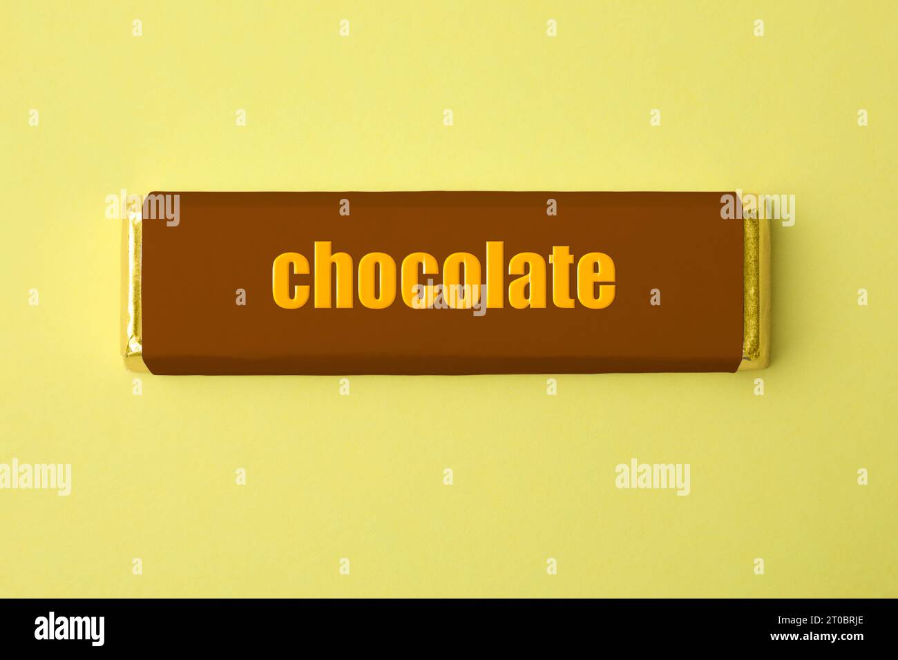 One chocolate bar in packaging on yellow background, top view Stock ...