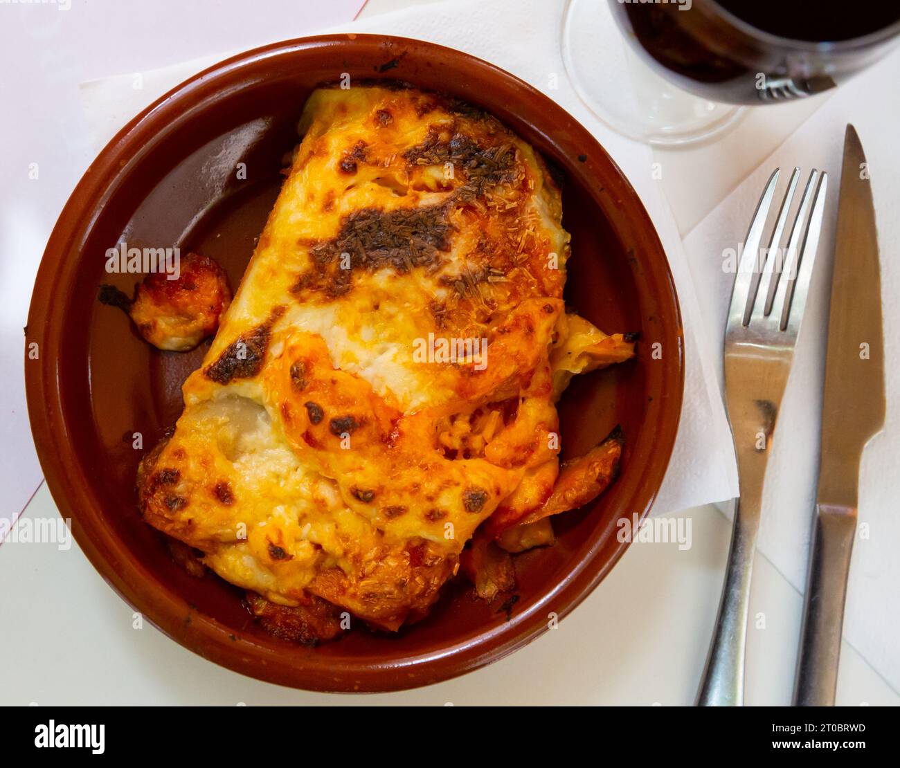 Italian meat lasagna in a clay plate Stock Photo - Alamy