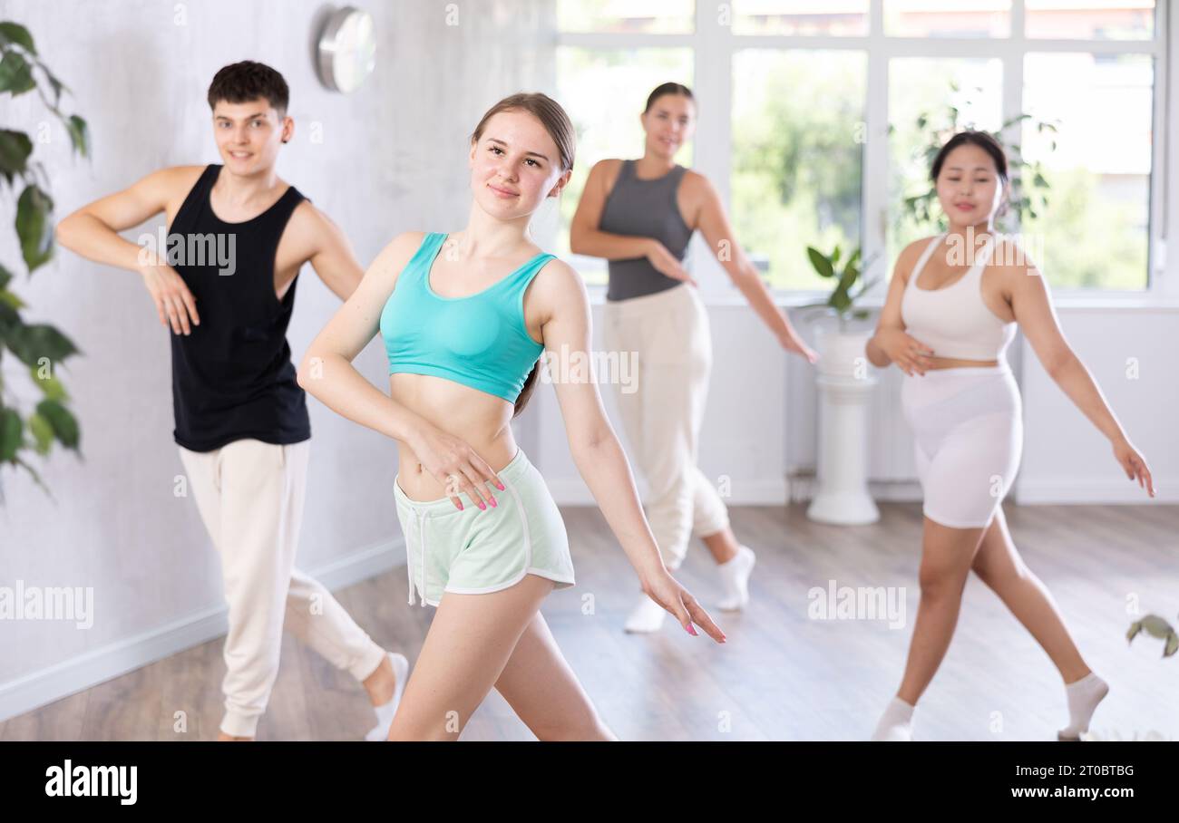 Group of young people dancing indoors Stock Photo - Alamy