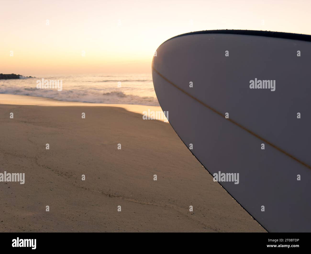 Surfboard nose shape with beach sunset on the background Stock Photo ...