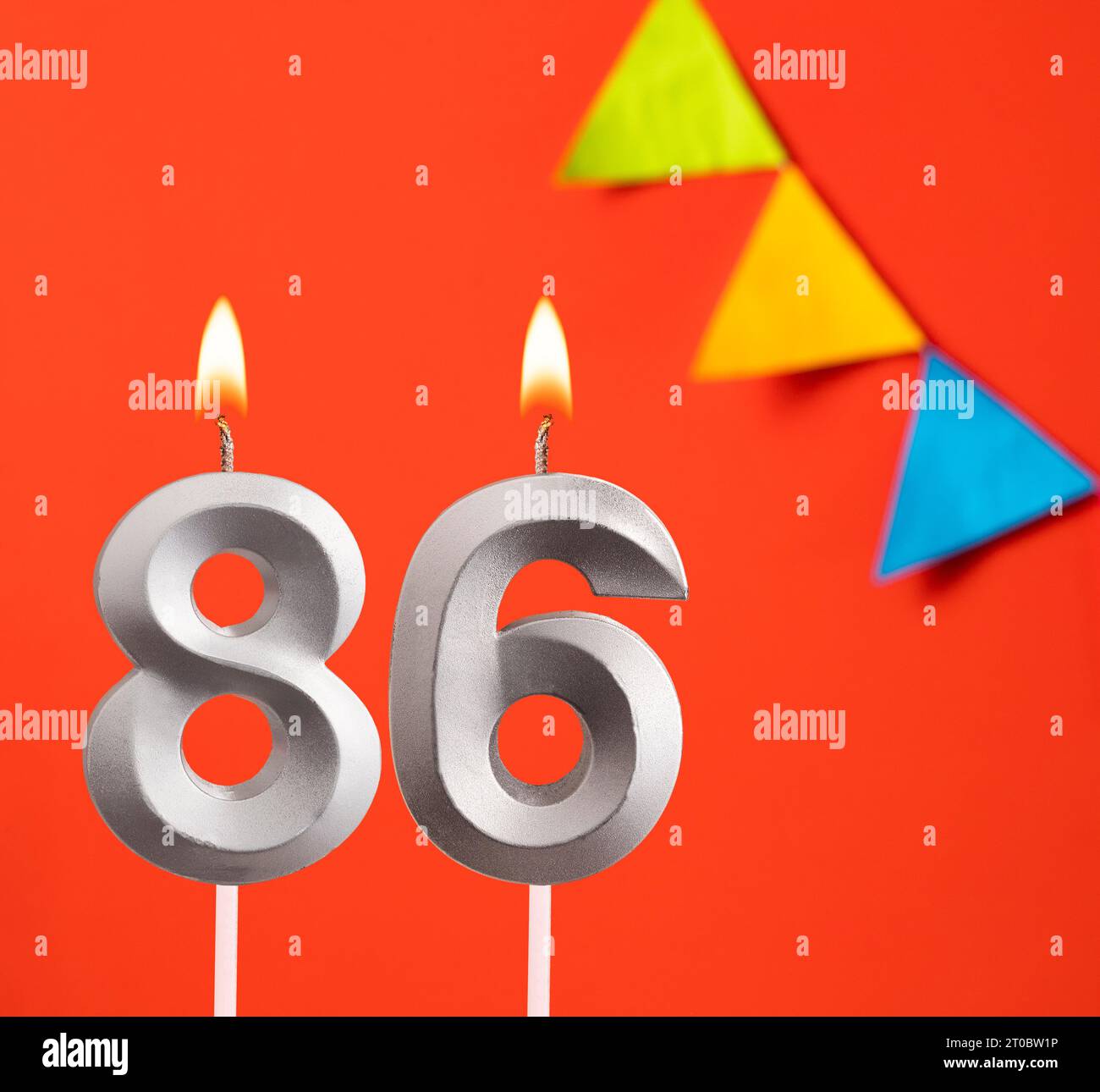 Birthday card - Number 86 candle in orange background Stock Photo - Alamy