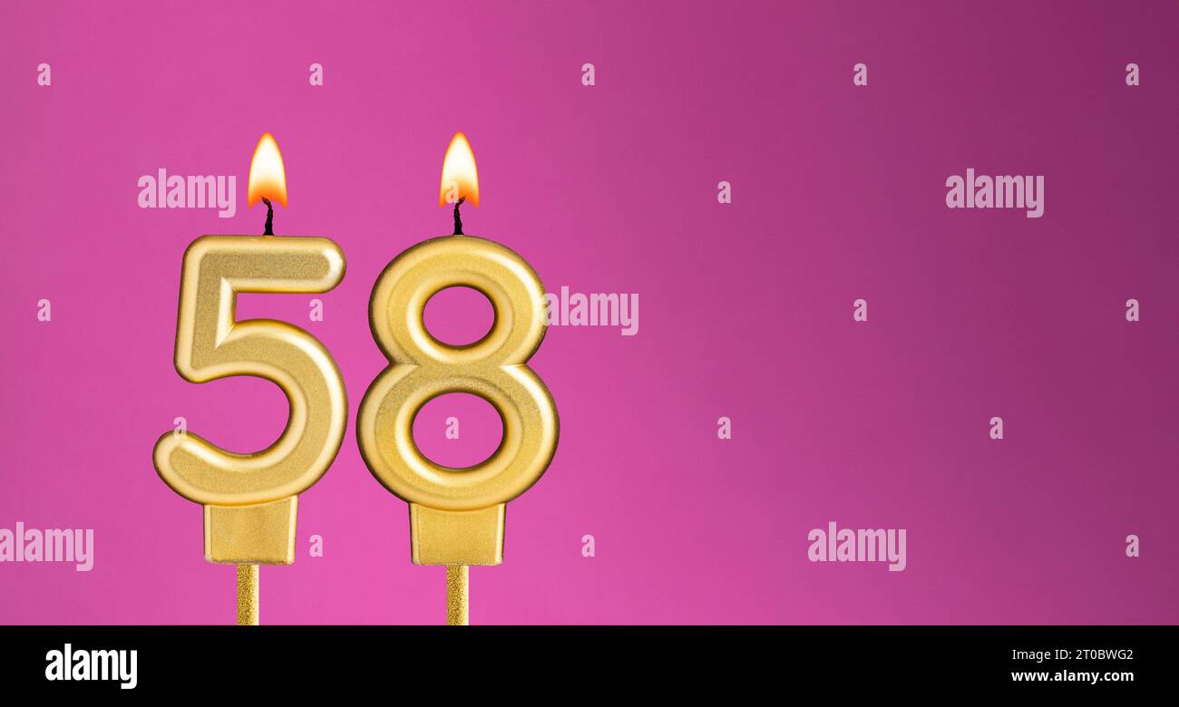 Birthday card with candle number 58 - purple background Stock Photo - Alamy