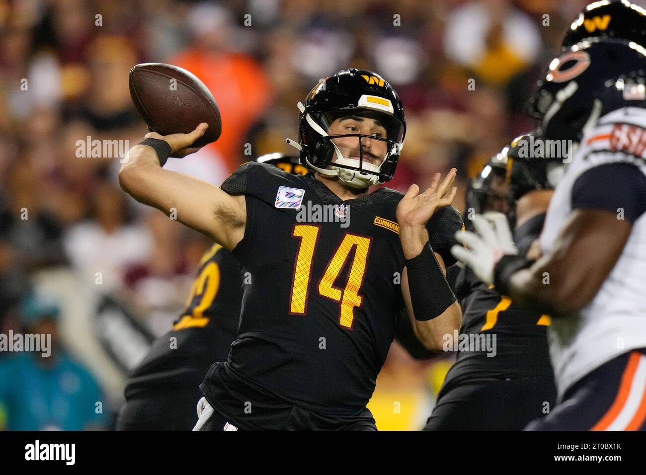 Washington Commanders quarterback Sam Howell (14) throwing the ball ...