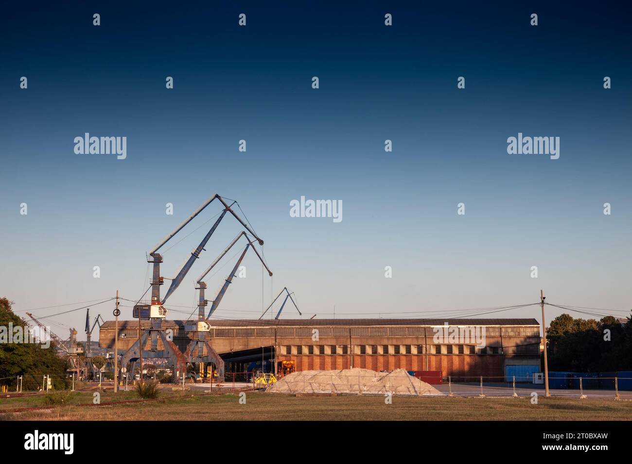 Picture of metal high cranes in a port of The balkans, in the port of ...
