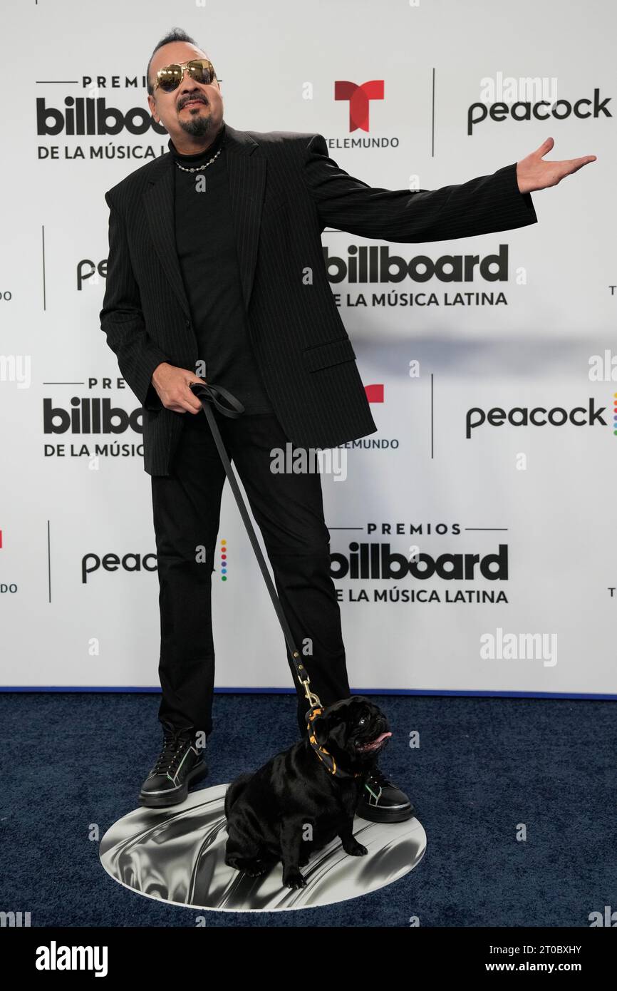 American singer Pepe Aguilar poses with his dog Gordo on the blue ...
